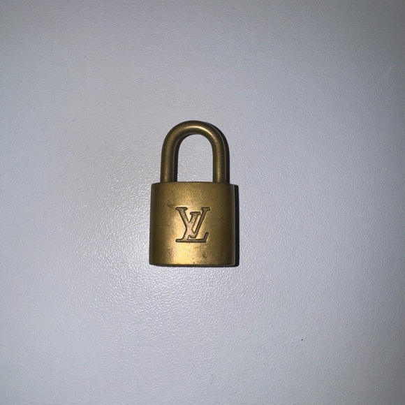Louis Vuitton | Jewelry | Louis Vuitton Lock | Poshmark